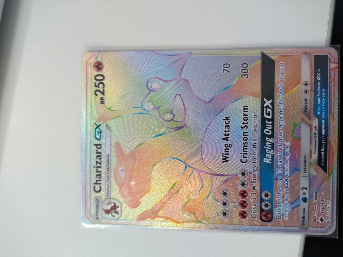 Damage or Printing error Rainbow Charizard GX? - CGC Cards General ...